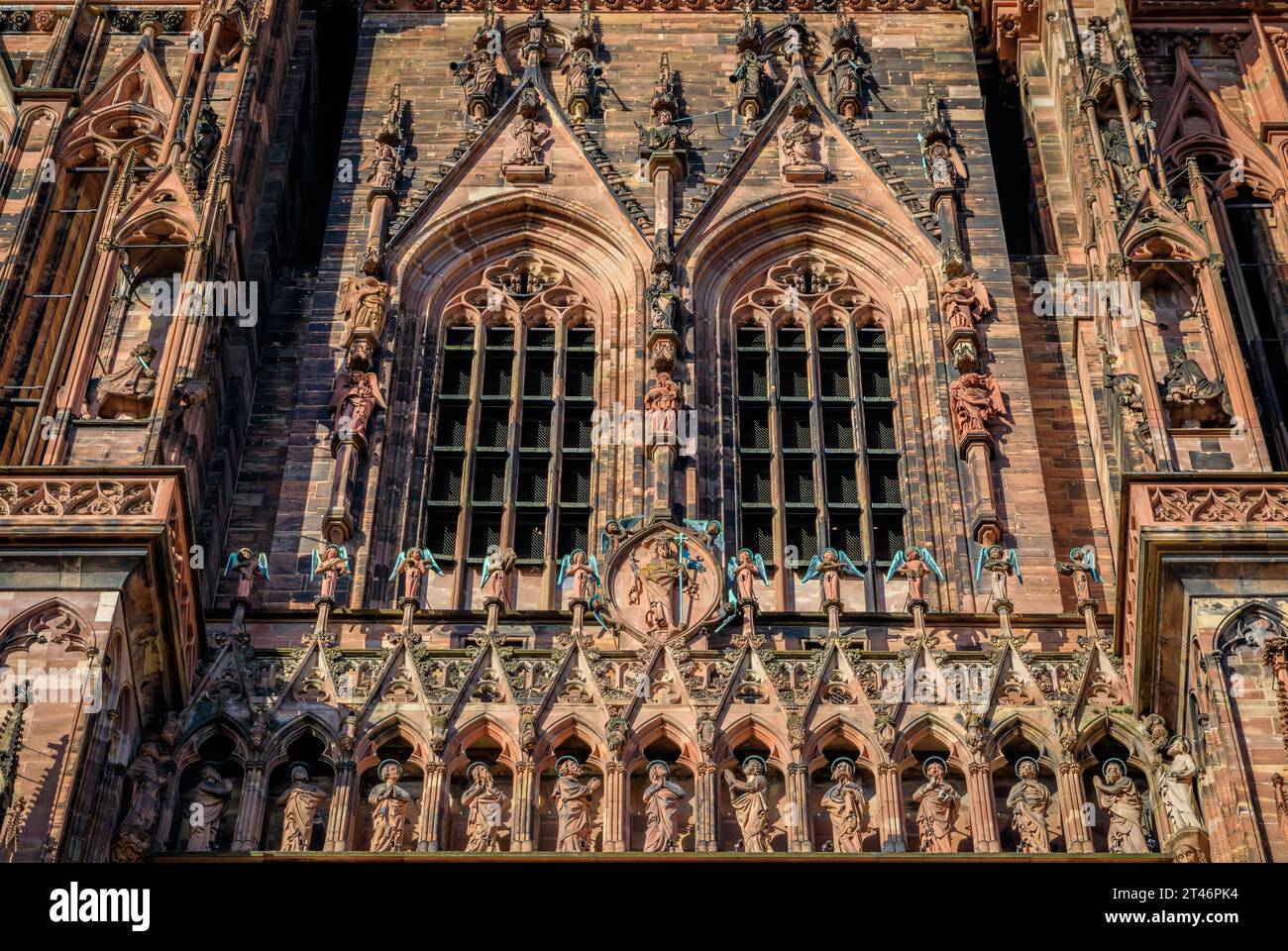 Ornate Gothic facade and the intricate windows of the Notre Dame ...