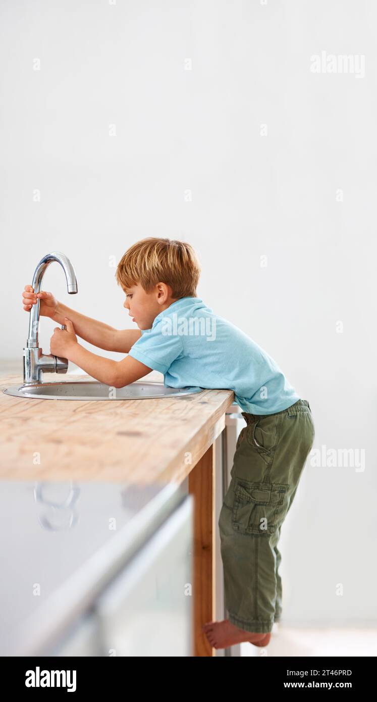 Children, fantasy and a child in the kitchen sink, playing a game in ...