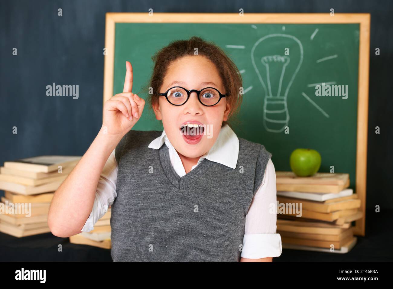 Solution, idea and portrait of student with light bulb on board for ...