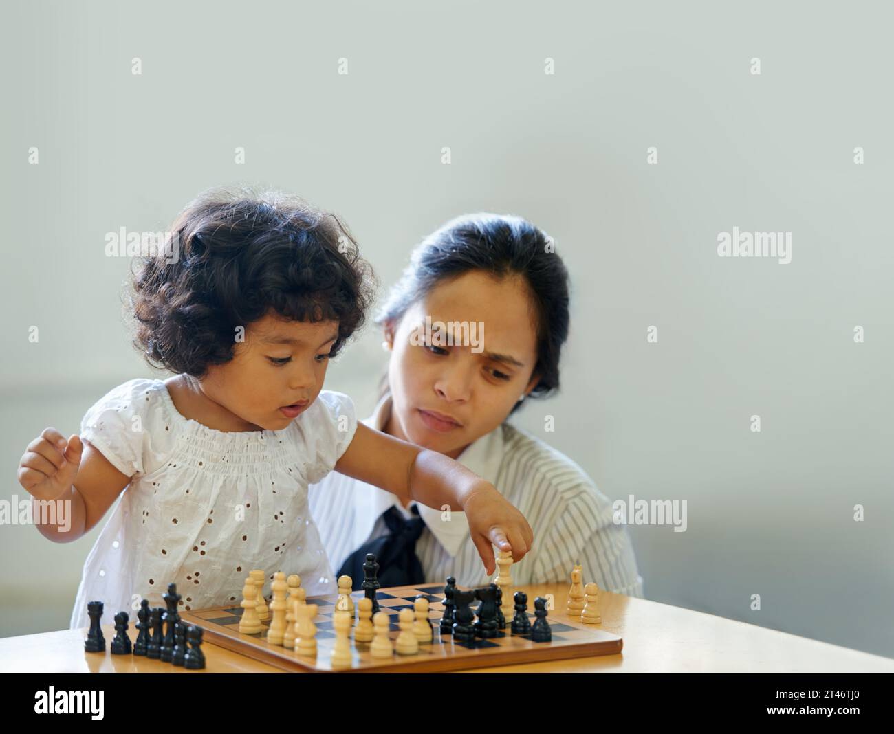 Mother, child and chess play for learning growth, development challenge ...