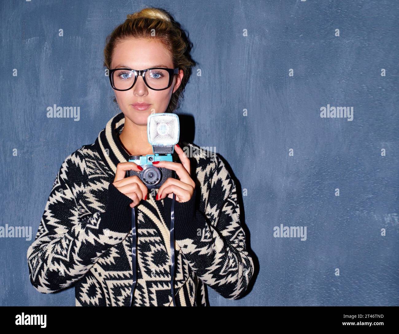 Woman, portrait and retro camera on wall background for aesthetic ...