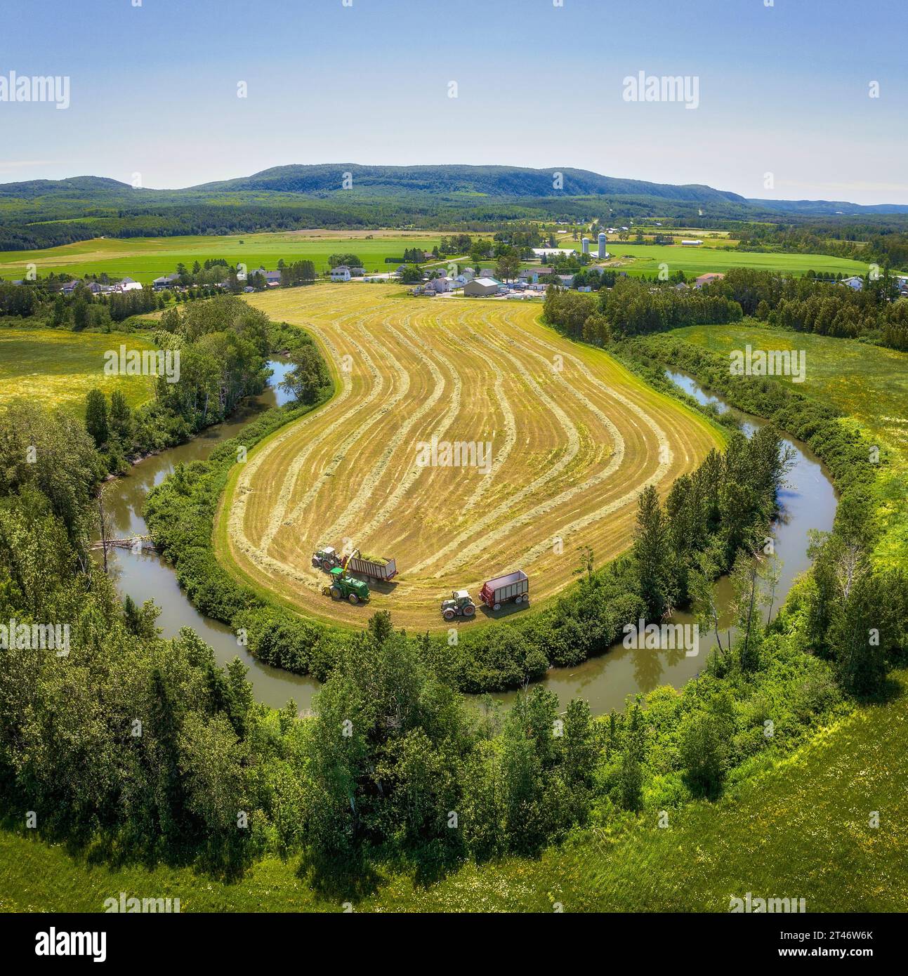 An aerial view of a rural farmstead surrounded by cultivated ...