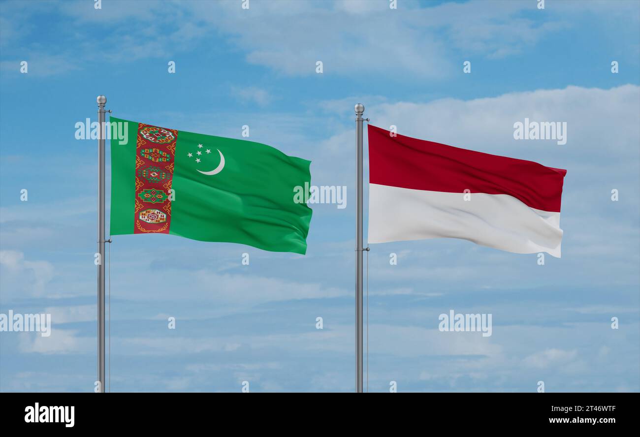 Indonesia and Turkmenistan flags waving together on blue cloudy sky, two country relationship ...