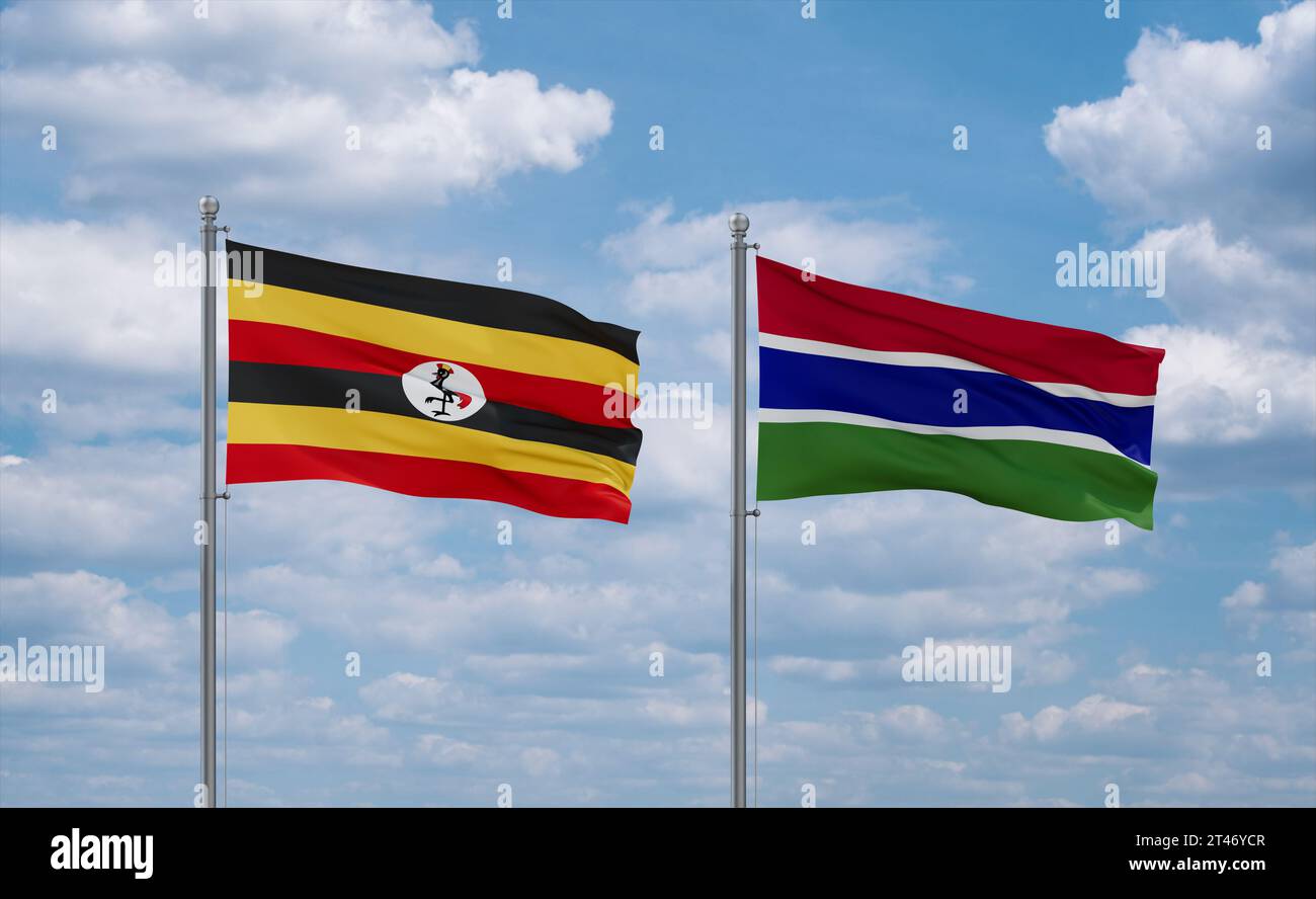 Gambia and Uganda flags waving together on blue cloudy sky, two country ...