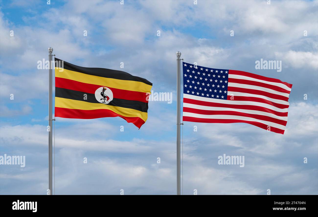 USA and Uganda flags waving together in the wind on blue cloudy sky ...