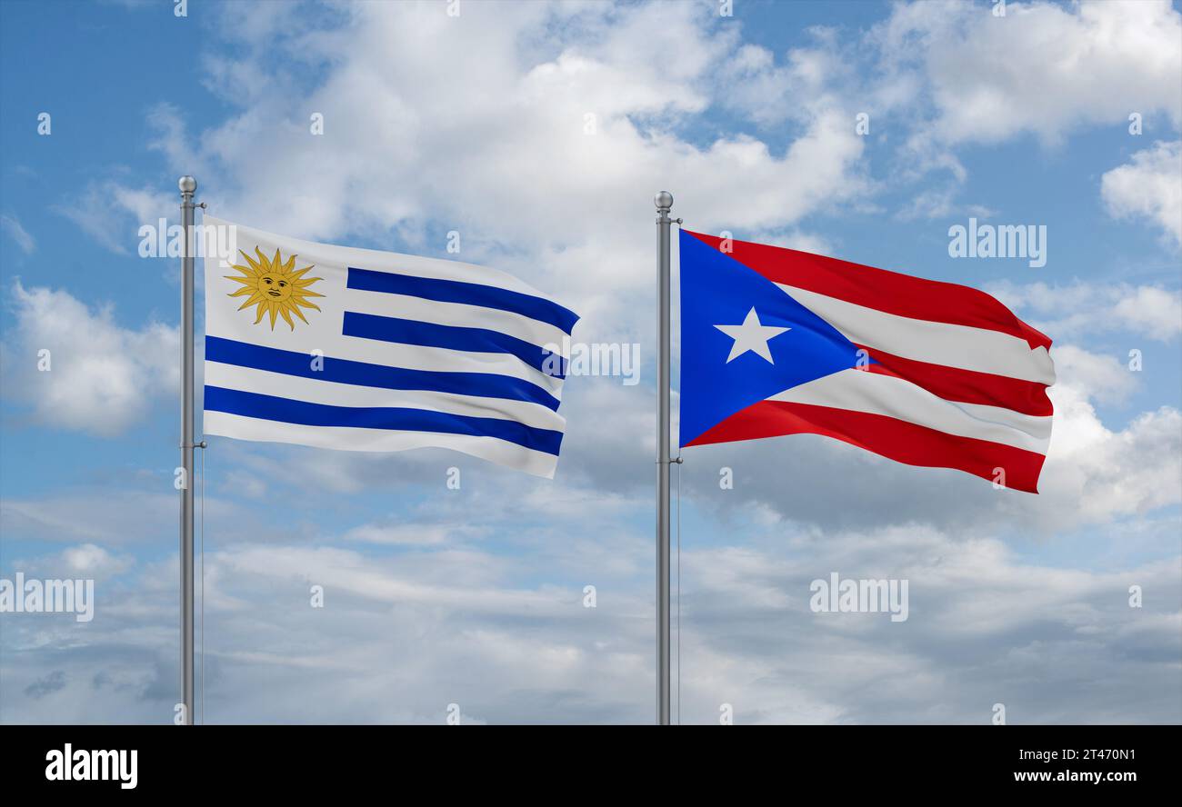 Puerto Rico and Uruguay flags waving together in the wind on blue ...