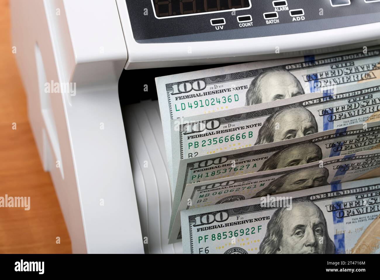 American money - dollars in a counting machine Stock Photo - Alamy