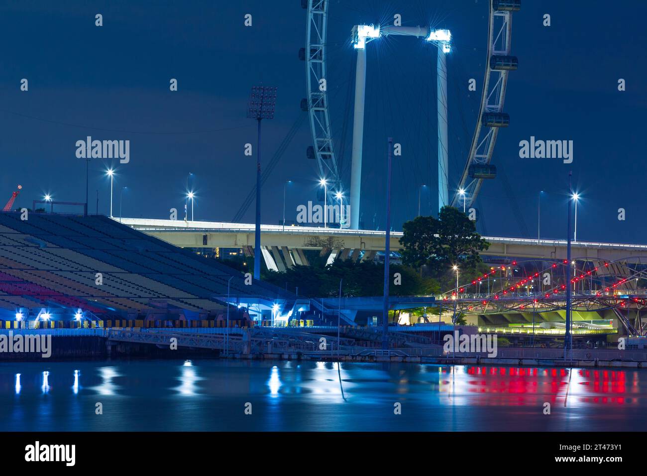 A night view of Marina Bay in Singapore with the Singapore Flyer, Helix ...