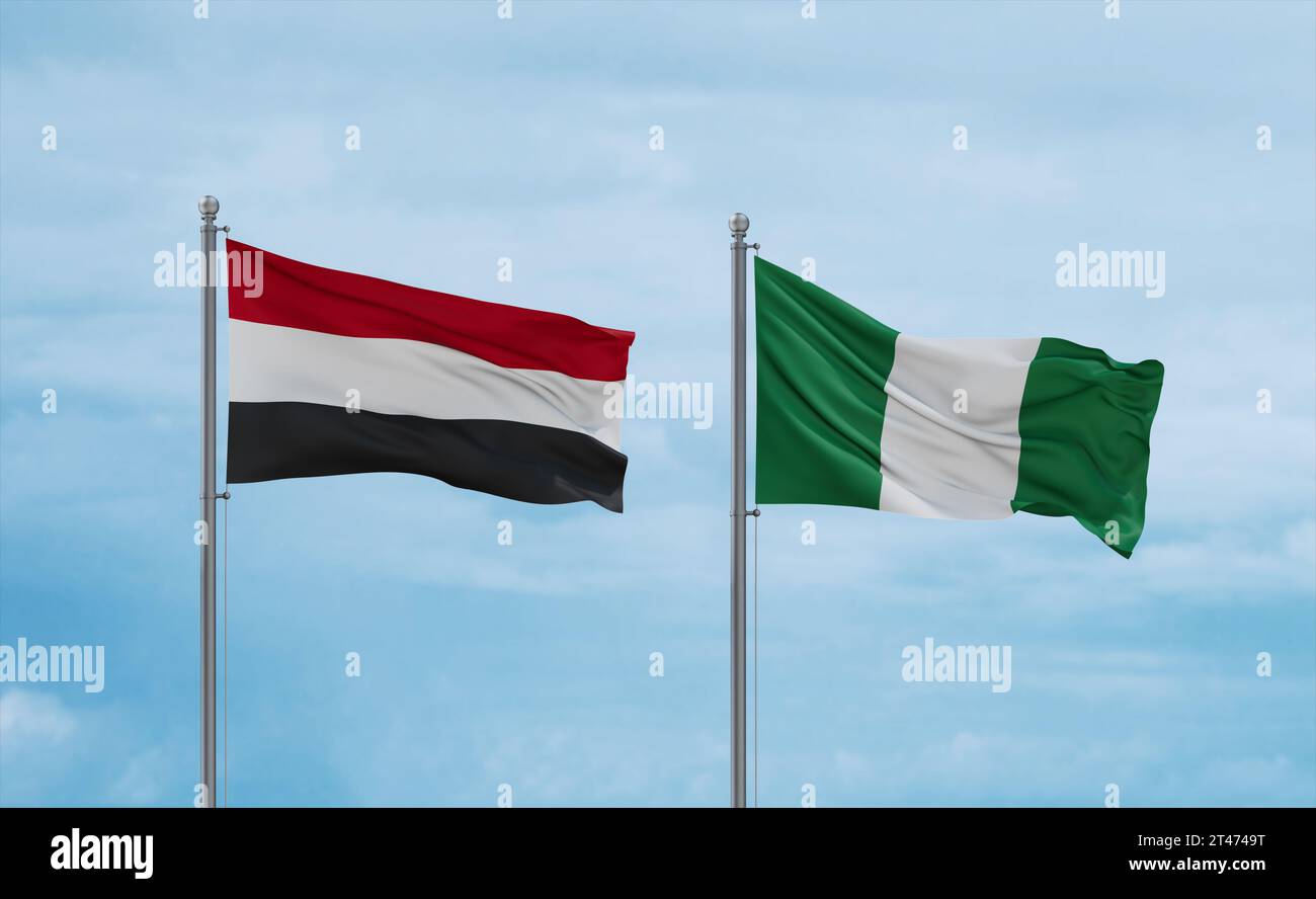 Nigeria and Yemen flags waving together on blue cloudy sky, two country ...