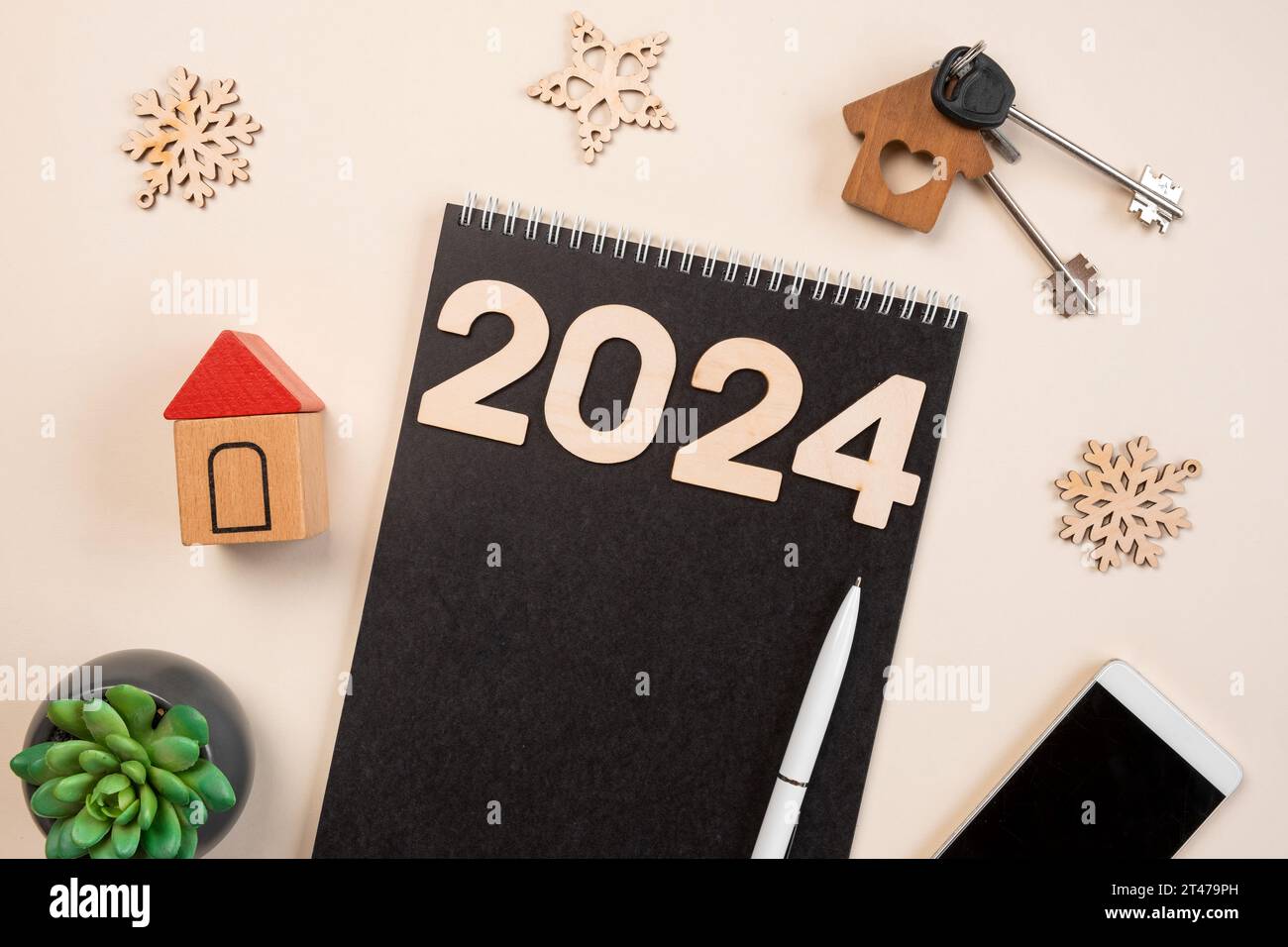 New Year Aims 2024. To Do List. Empty Notebook at the Desk with Decorative House Model. Top view ...