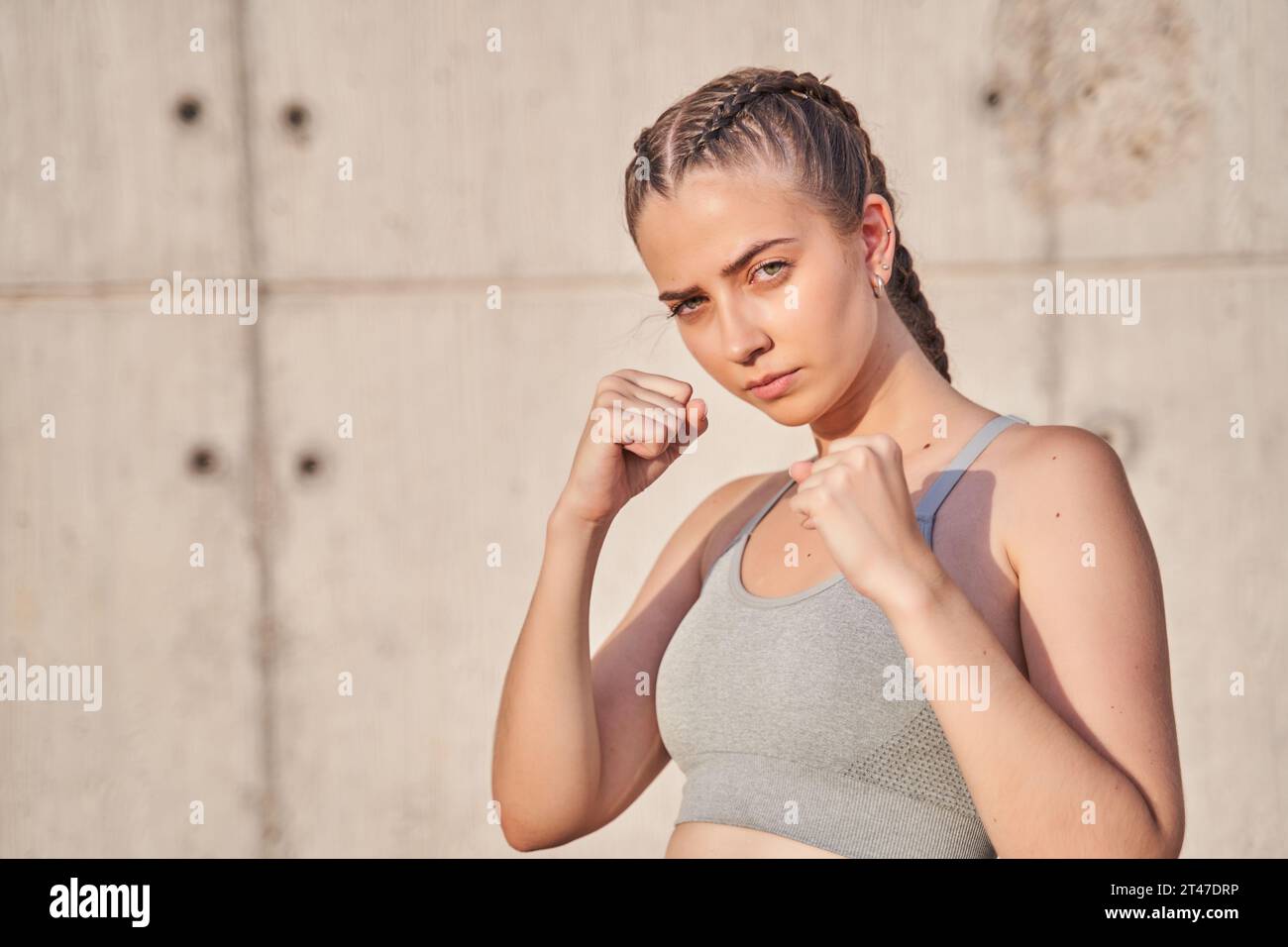 Portrait of a woman in a combat stance, Beautiful and fit female ...