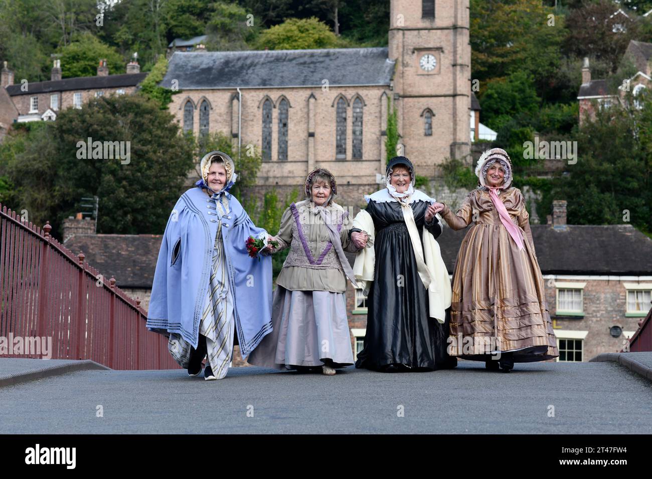 Ladies in Victorian period dress costumes in Ironbridge, Shropshire a ...