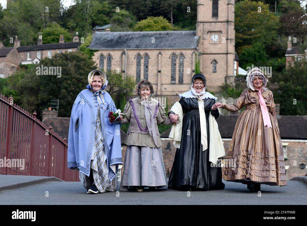 Ladies in Victorian period dress costumes in Ironbridge, Shropshire a ...