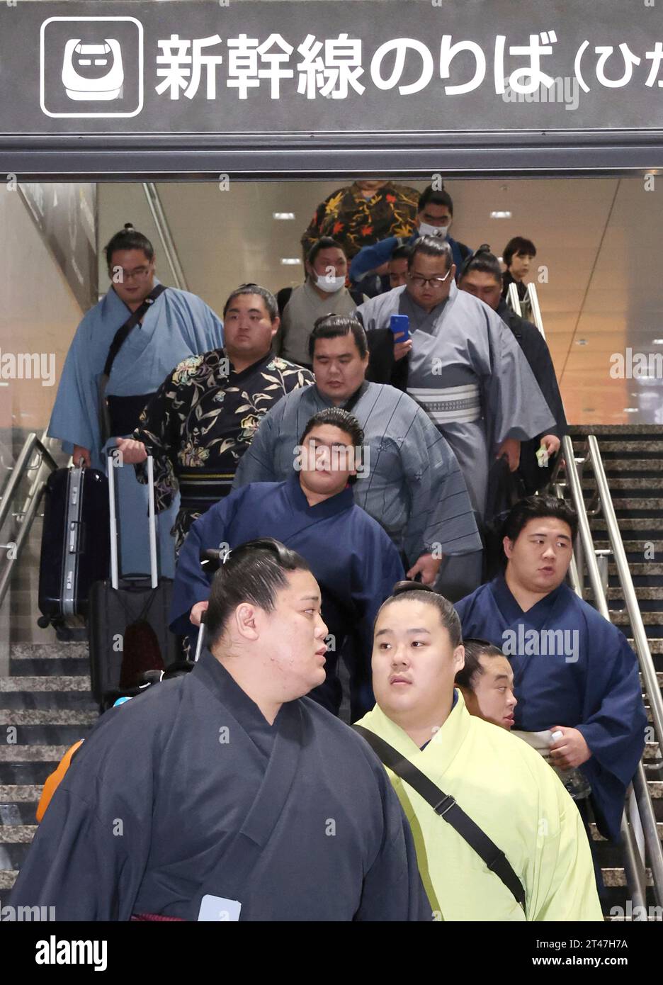 Sumo wrestlers arrive at JR Hakata Station by Shinkansen (Bullet train ...