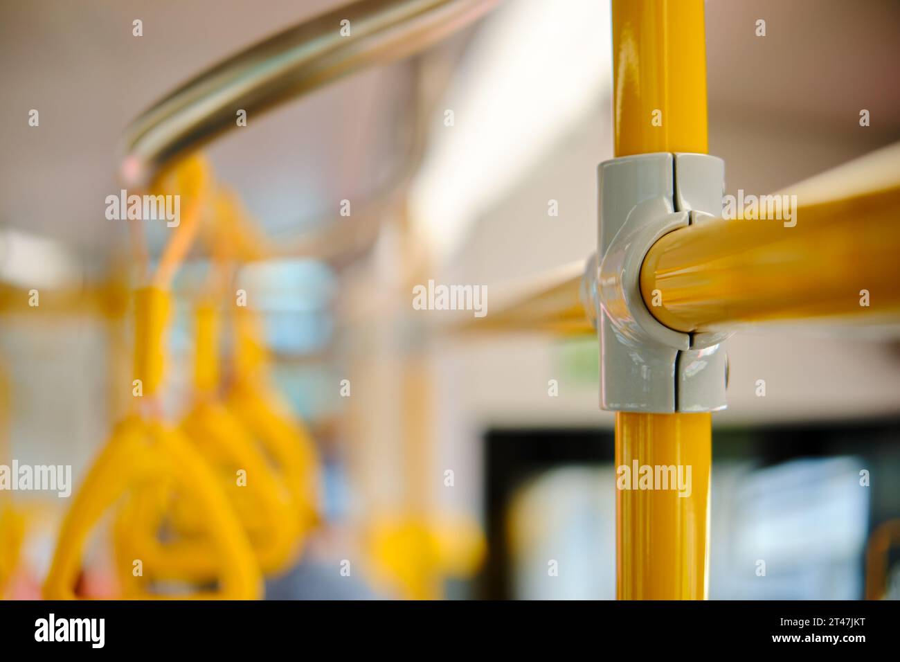 Close up of yellow metal railings in a public transport bus Stock Photo ...
