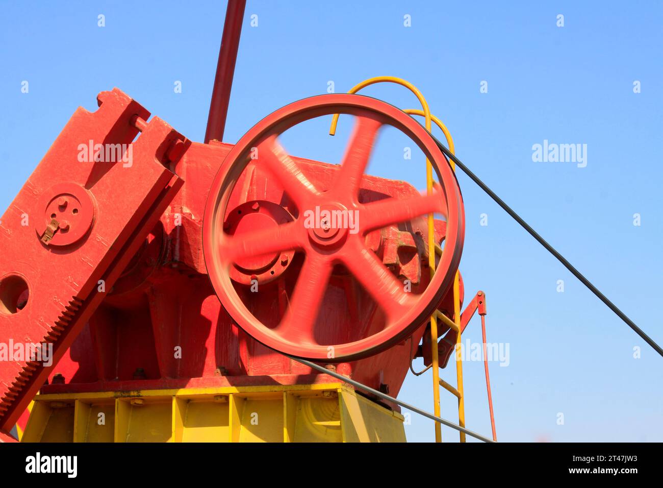 Beam pumping unit rotating wheels, closeup of photo Stock Photo - Alamy