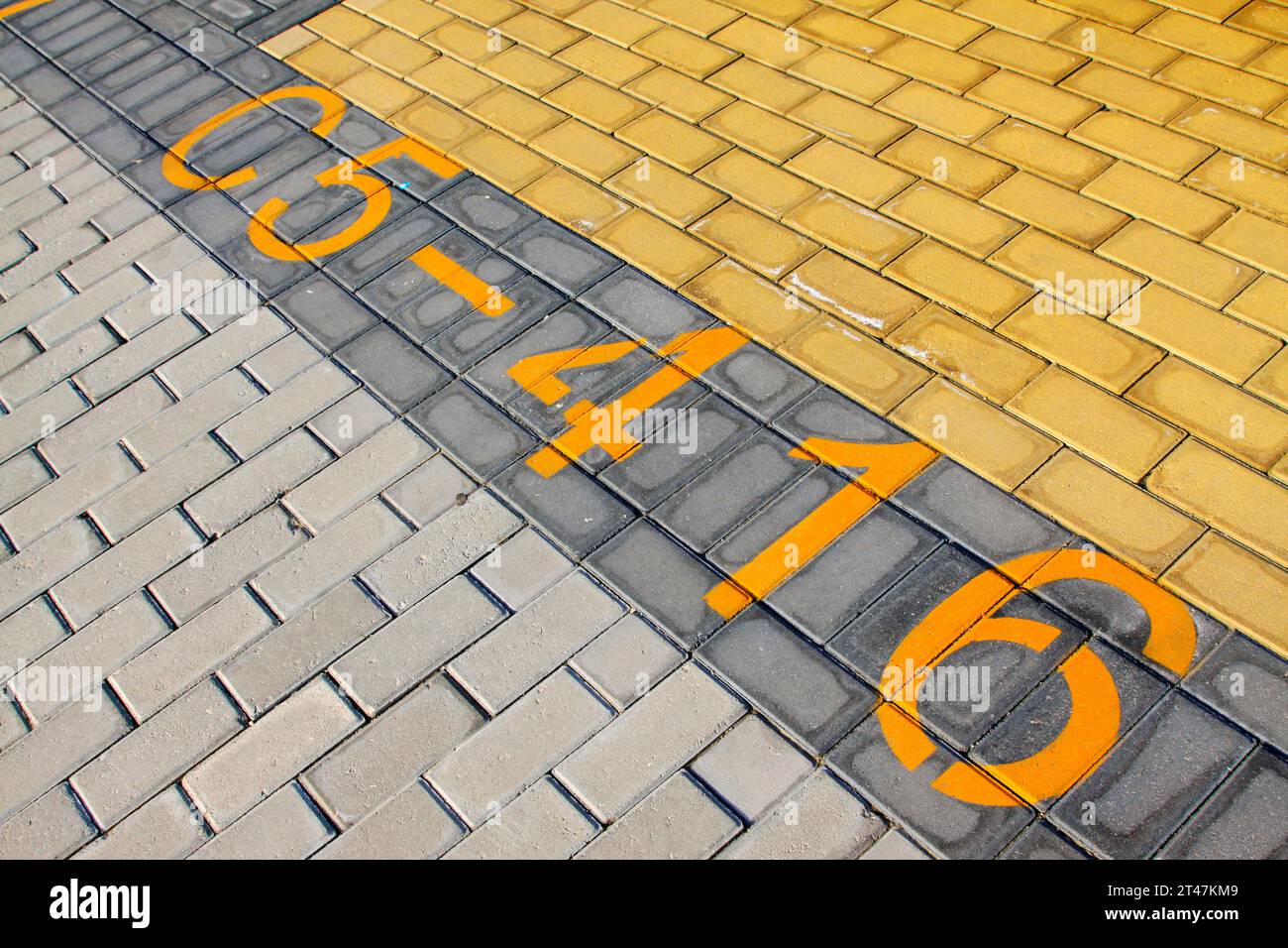 yellow numbers on color cement block, closeup of photo Stock Photo - Alamy
