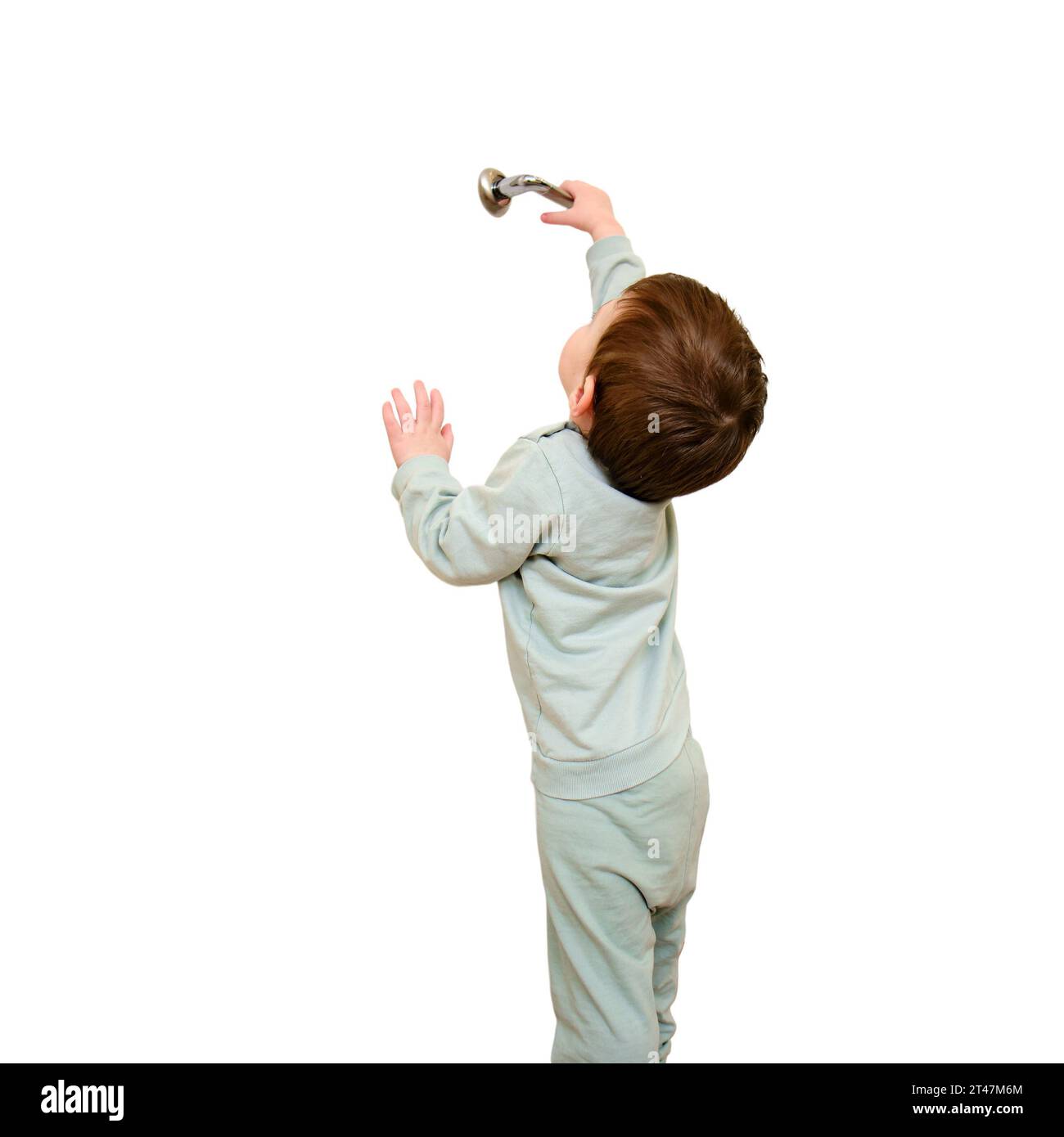 Little baby opens the door, isolated on white background. Child pulls ...