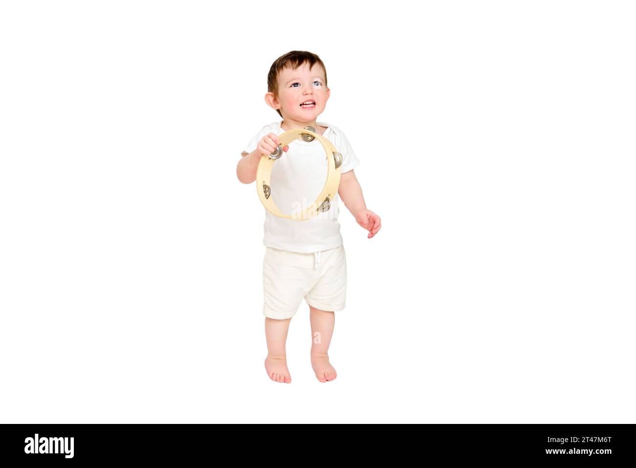 Happy baby play musical instruments on studio, isolated on white ...