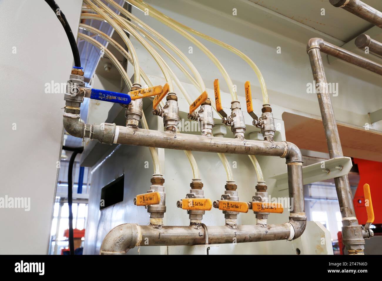 plastic pipe and control valves in the manufacturing production line ...