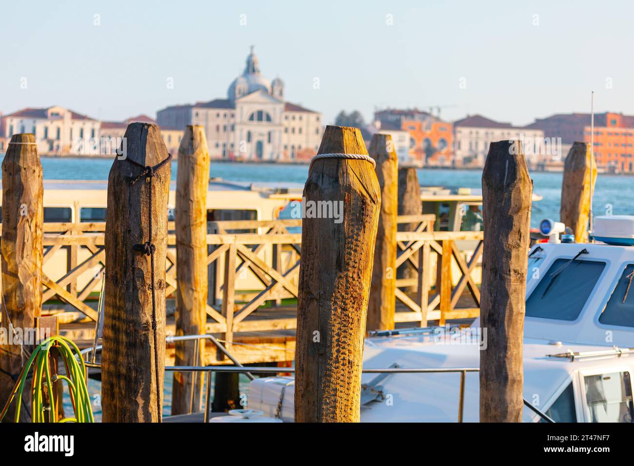 Harbor wooden pillars of the Grand Canal in Venice, Italy Stock Photo ...