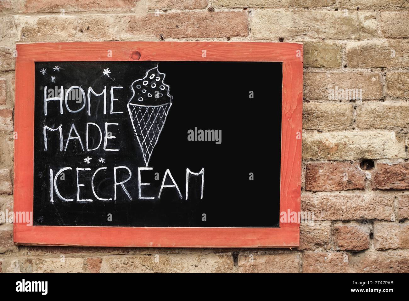 hand drawn home made icecream sign board hanged on a wall Stock Photo ...
