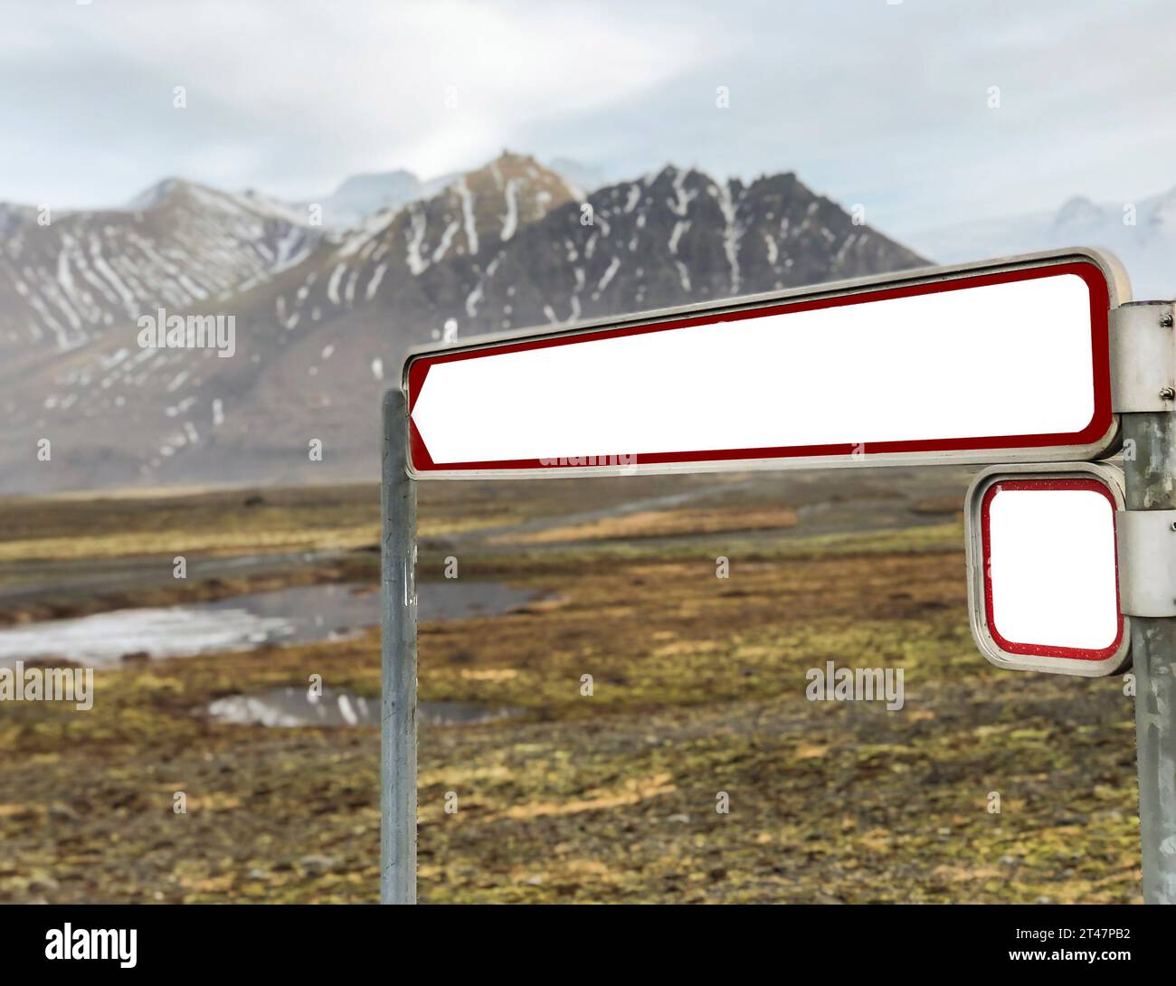 An empty road direction sign at nature Stock Photo - Alamy