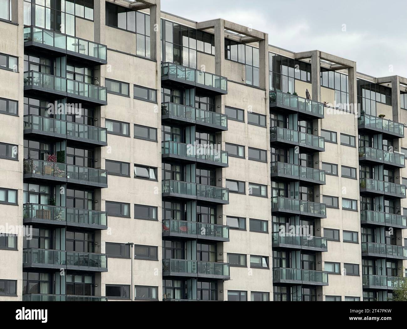 Modern high rise flats at new development on waterfront Stock Photo - Alamy