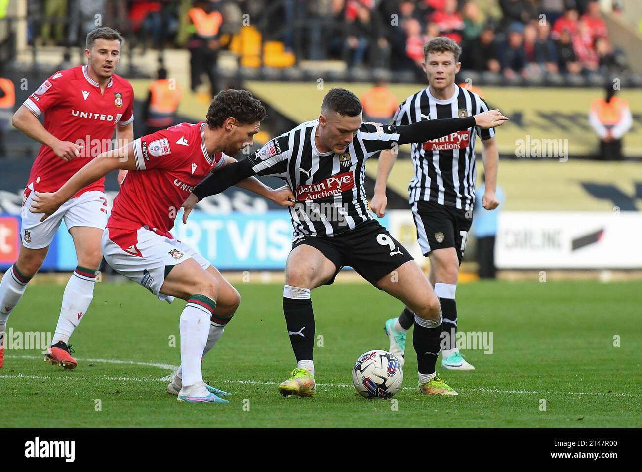 Macaulay Langstaff of Notts County holds off George Evans of Wrexham ...