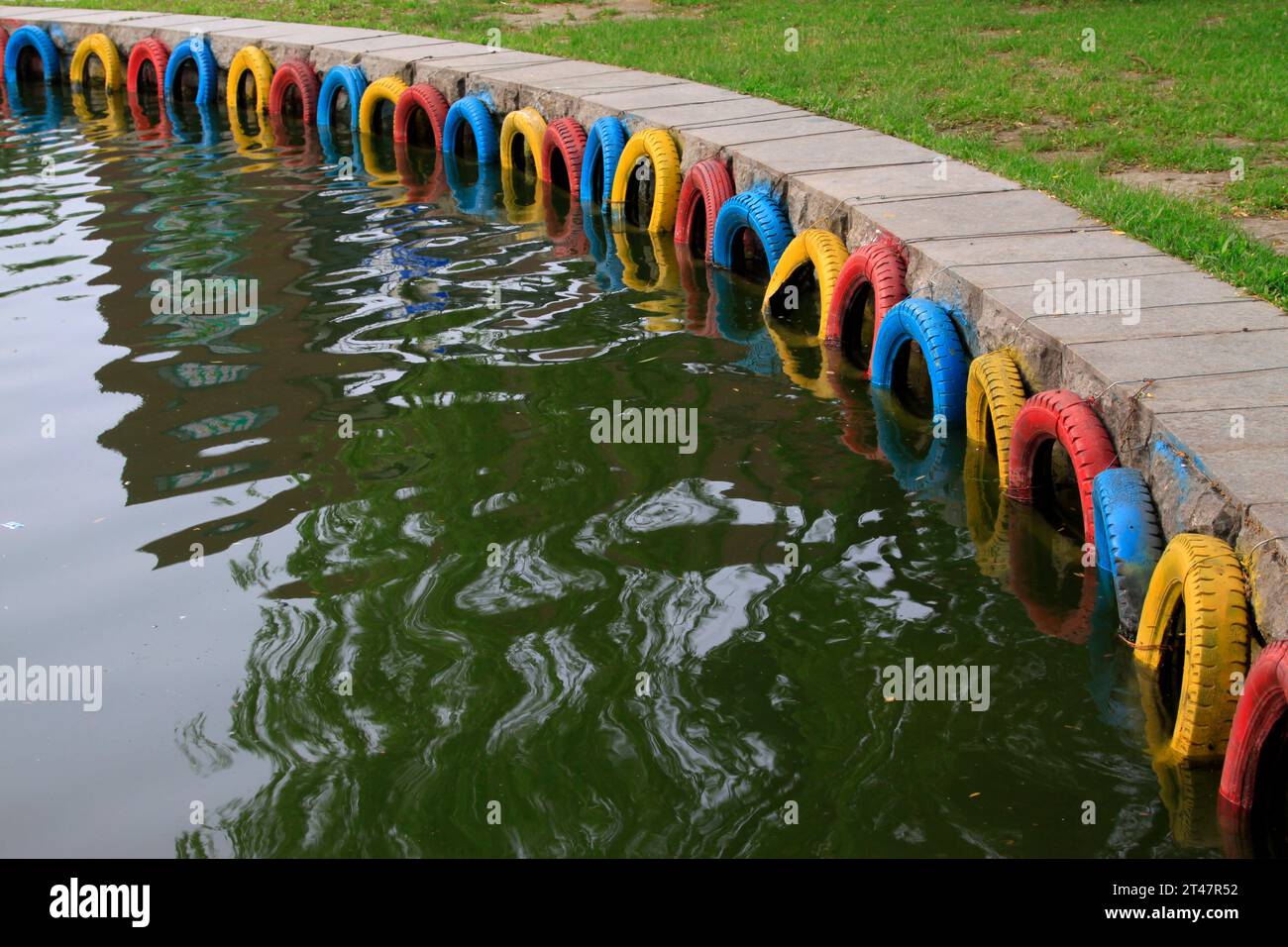 color tyres by the river in a park, closeup of photo Stock Photo - Alamy