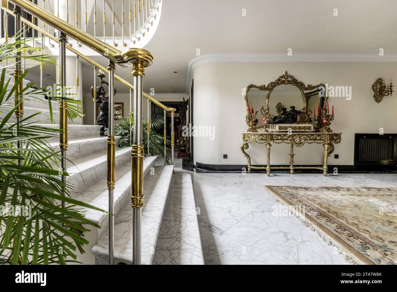 Staircase of a luxury house with chrome metal railing and golden ...