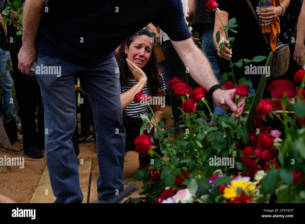 Friends and relatives of Yonat Or mourn next to her grave during her ...
