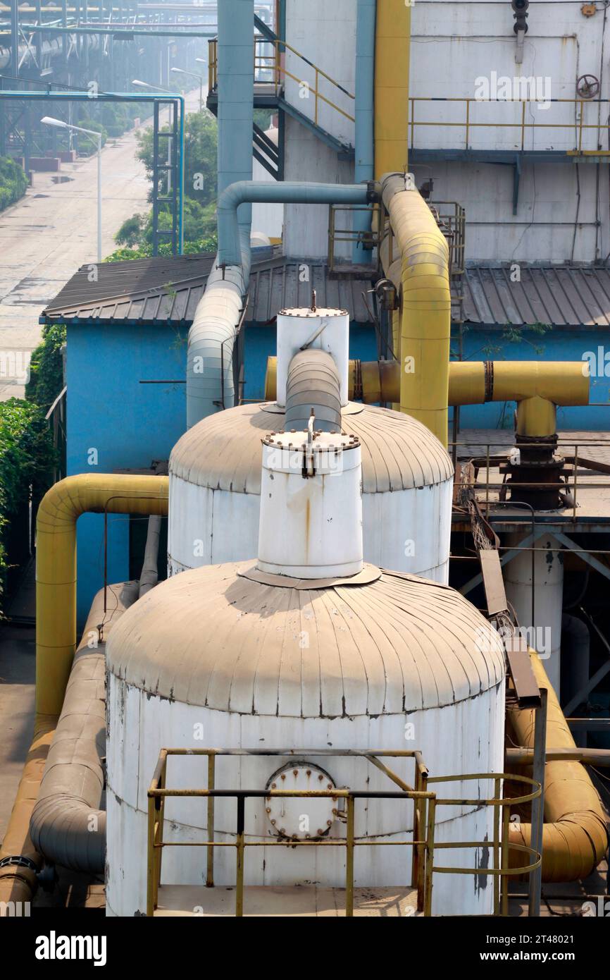 mechanical equipment and storage tanks in a factory Stock Photo - Alamy