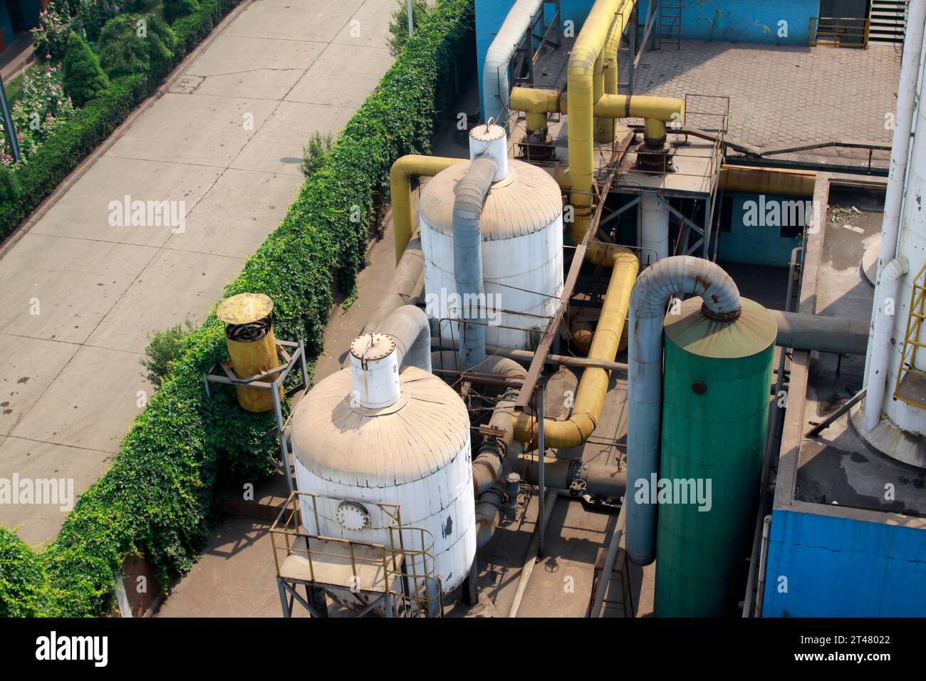 mechanical equipment and storage tanks in a factory Stock Photo - Alamy