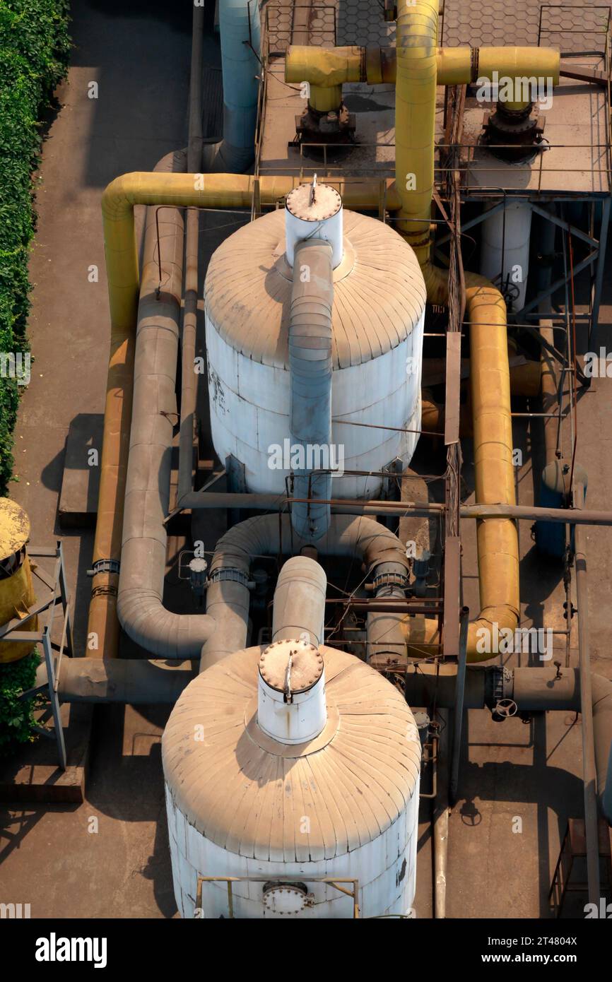 mechanical equipment and storage tanks in a factory Stock Photo - Alamy