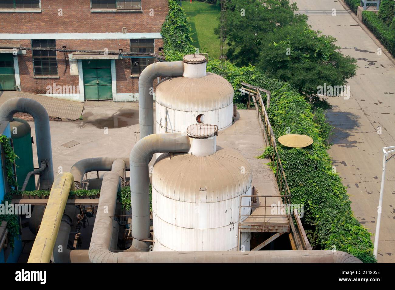 mechanical equipment and storage tanks in a factory Stock Photo - Alamy