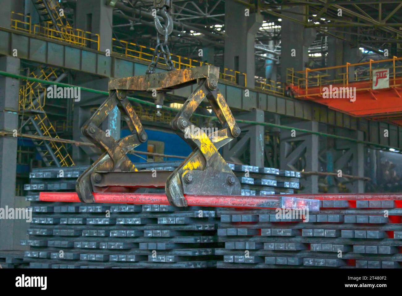 steel ingot hoisting in a workshop, closeup of photo Stock Photo - Alamy
