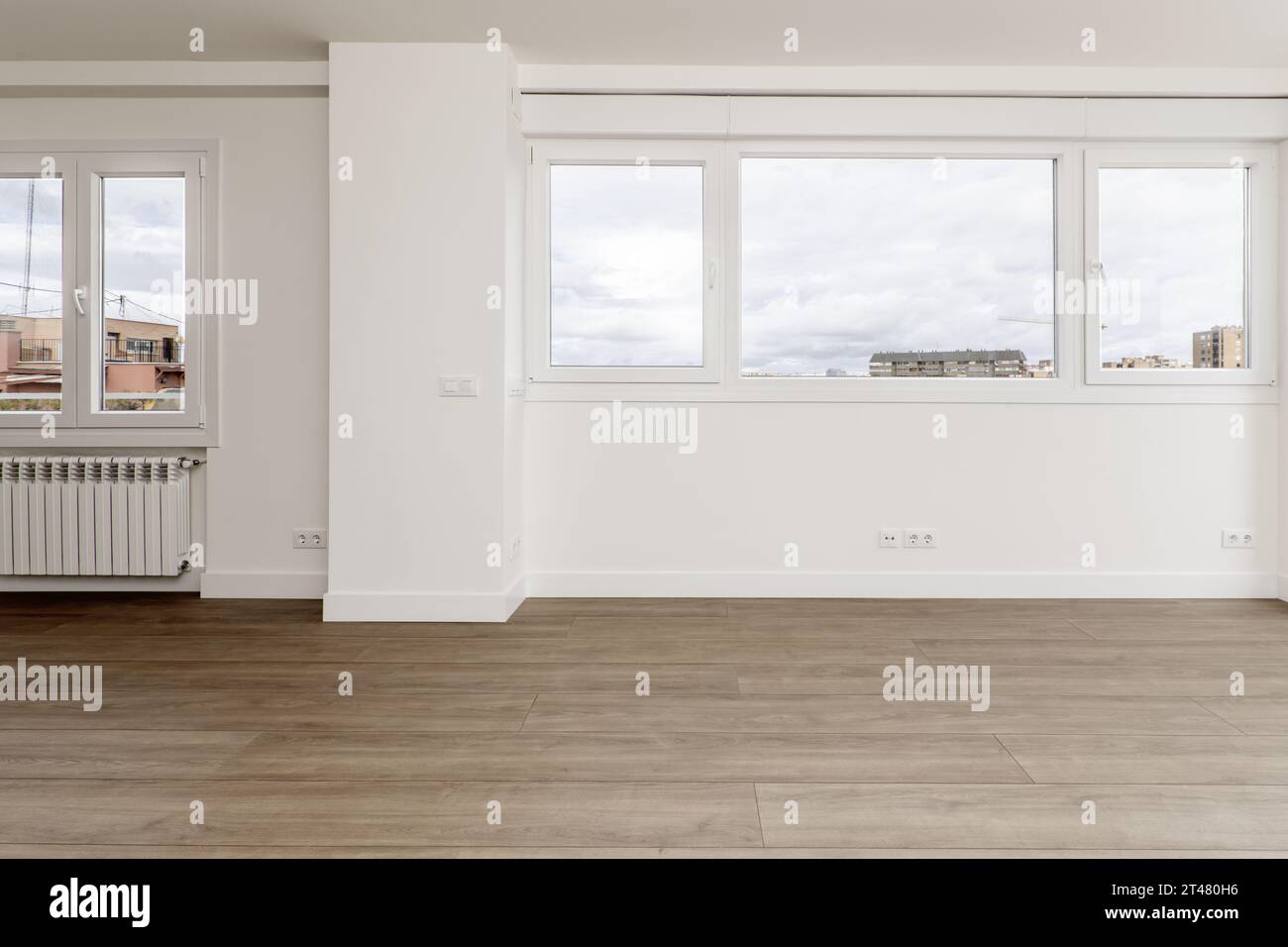 Wall full of windows with views of a living room Stock Photo - Alamy