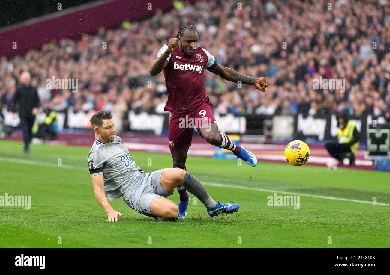 Everton's James Tarkowski tackles West Ham United's Michail Antonio ...