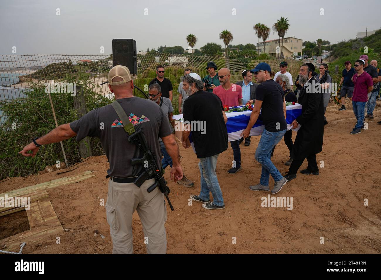 Friends and relatives of Yonat Or carry her coffin during her funeral ...