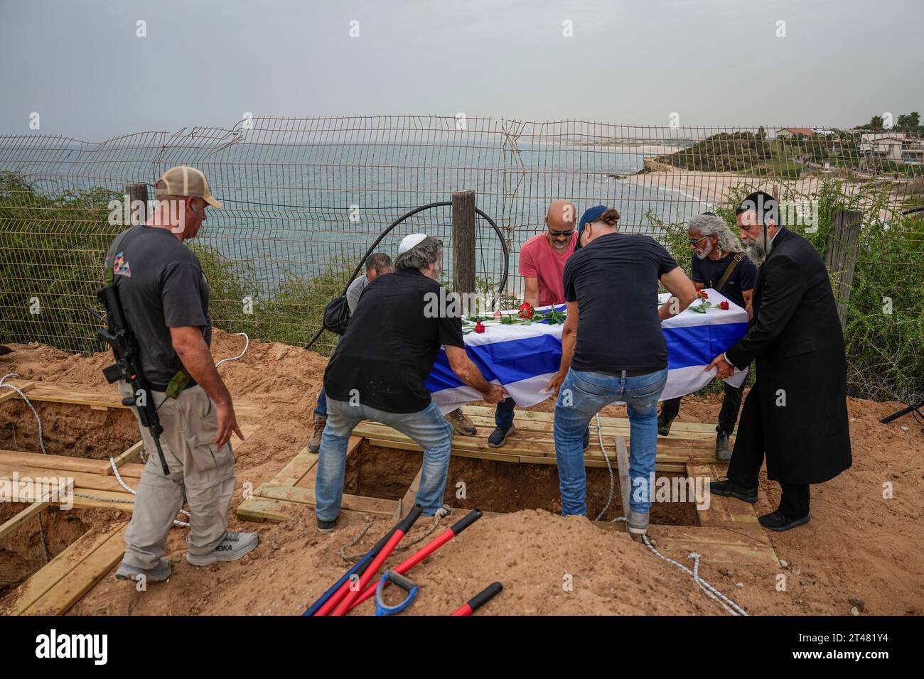Friends and relatives of Yonat Or carry her coffin during her funeral ...