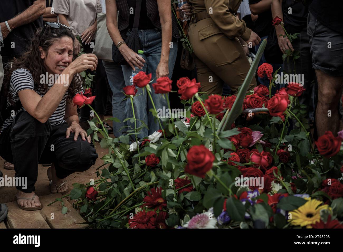 Palmachim, Israel. 29th Oct, 2023. A woman weeps BY the grave of Yonat ...