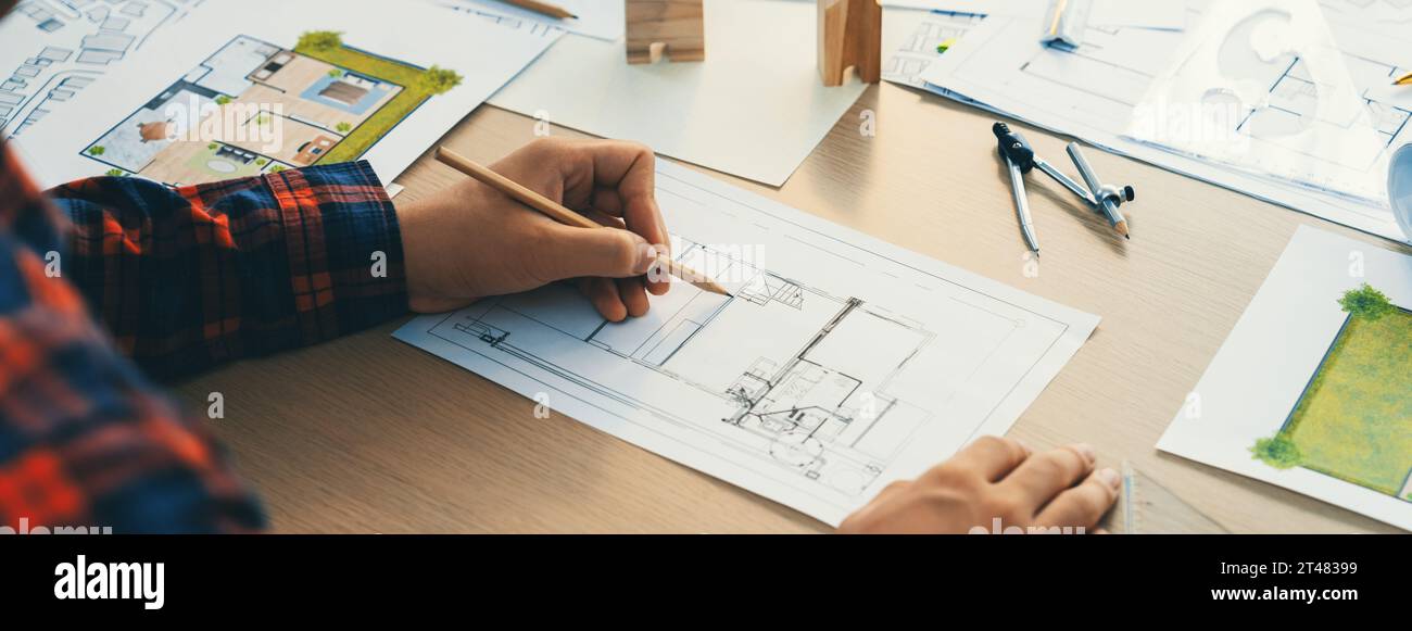 Closeup of architect engineer hand using ruler to mature and draw a ...