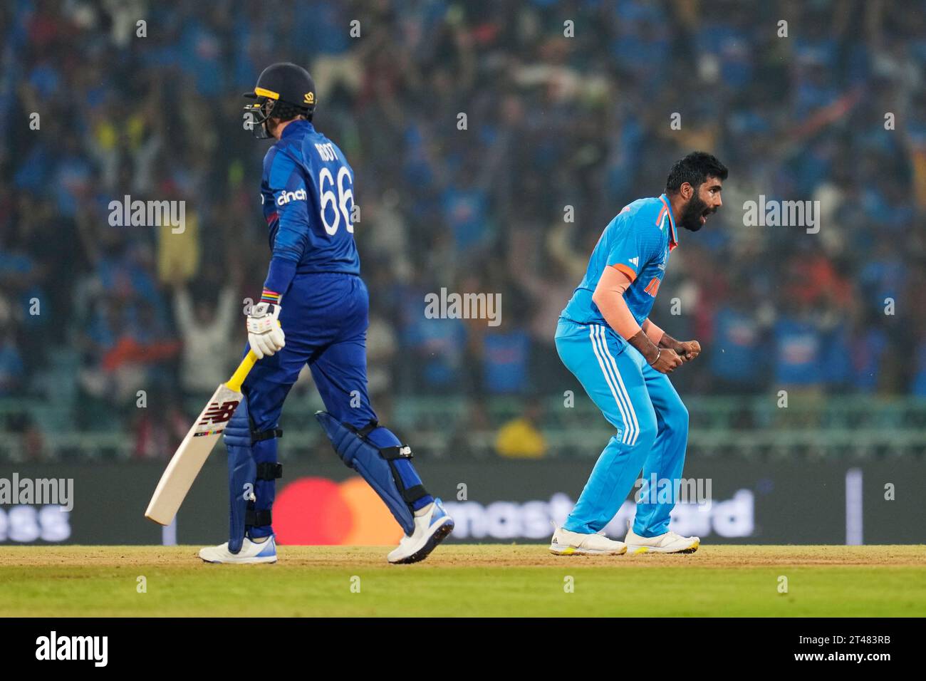 India's Jasprit Bumrah, right, celebrates the wicket of England's Joe ...