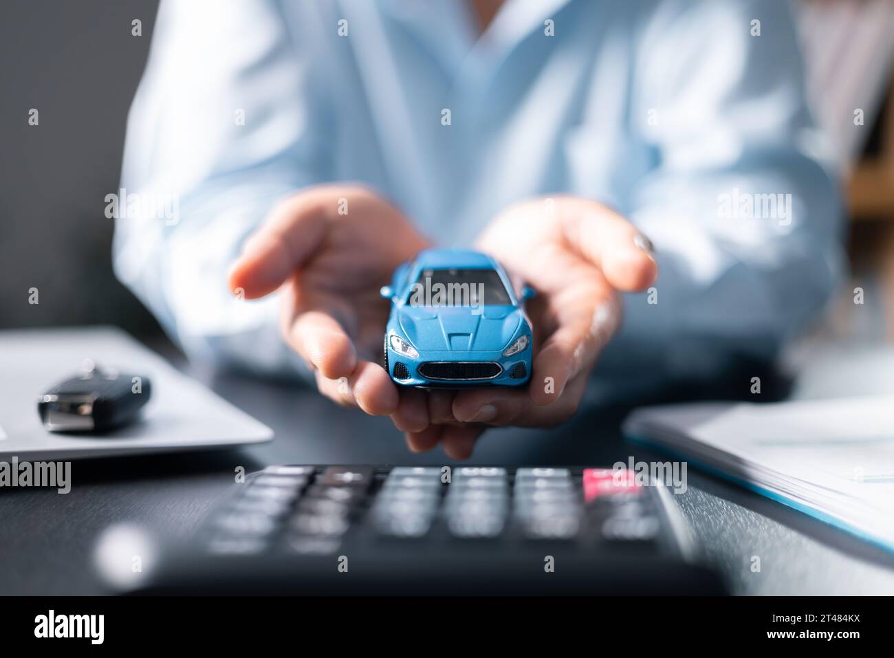 Car finance and insurance concept. Young woman selling or buying car ...