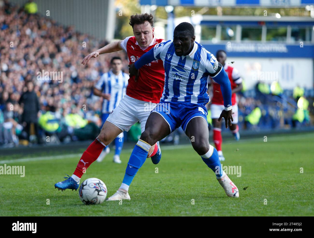 Rotherham United's Ollie Rathbone battles for the ball with Sheffield ...