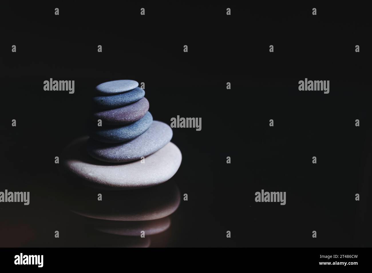 Smooth stones stacked with black background - Stacked pebbles and free ...