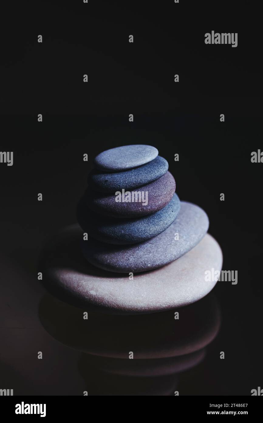 Smooth stones stacked with black background - Stacked pebbles and free ...