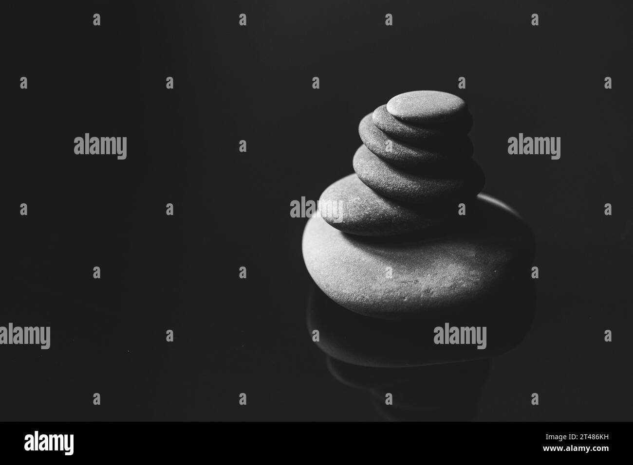 Smooth stones stacked with black background - Stacked pebbles and free ...