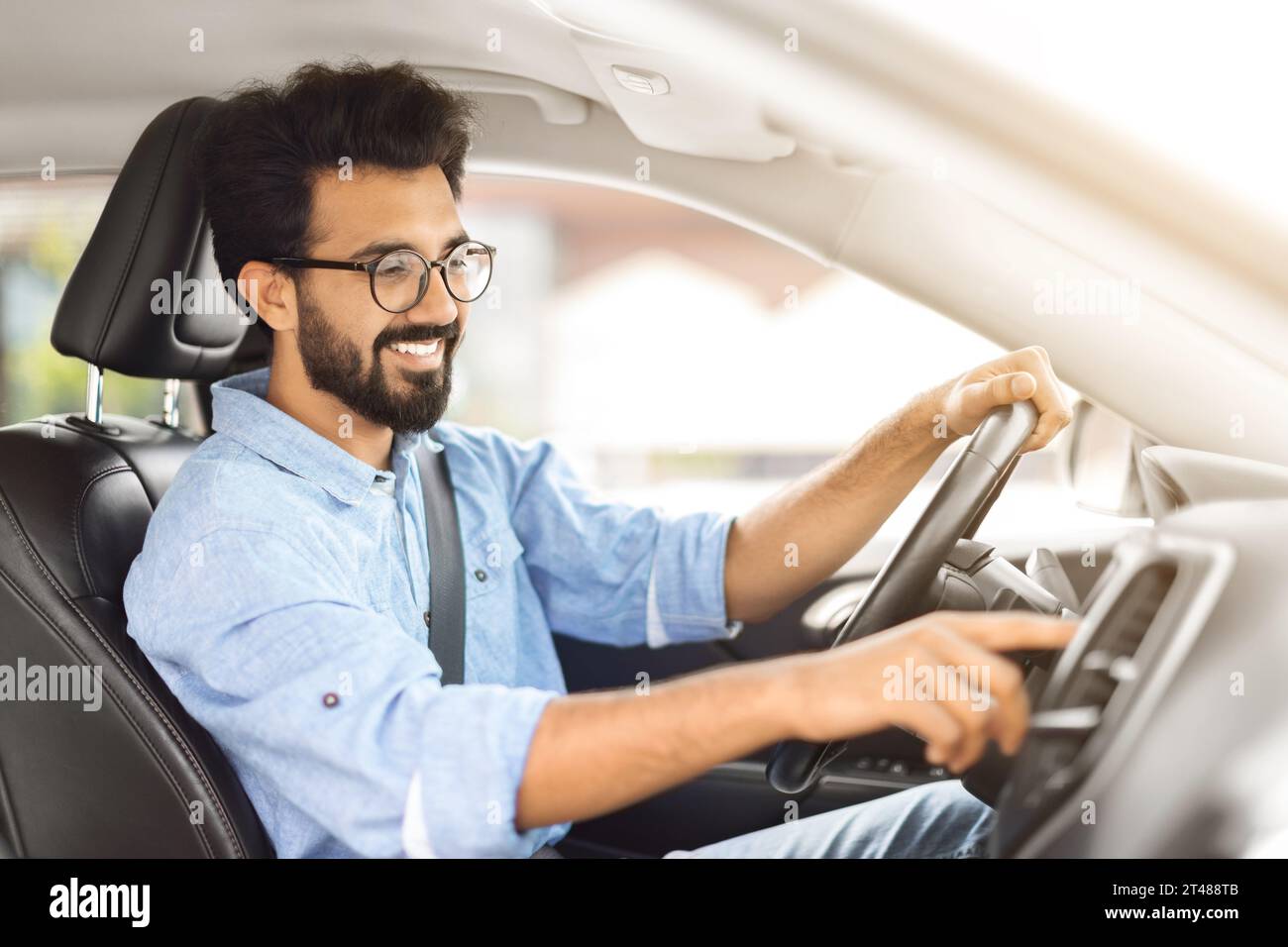 Happy Indian Man Driving Car And Listening To Music Stock Photo - Alamy